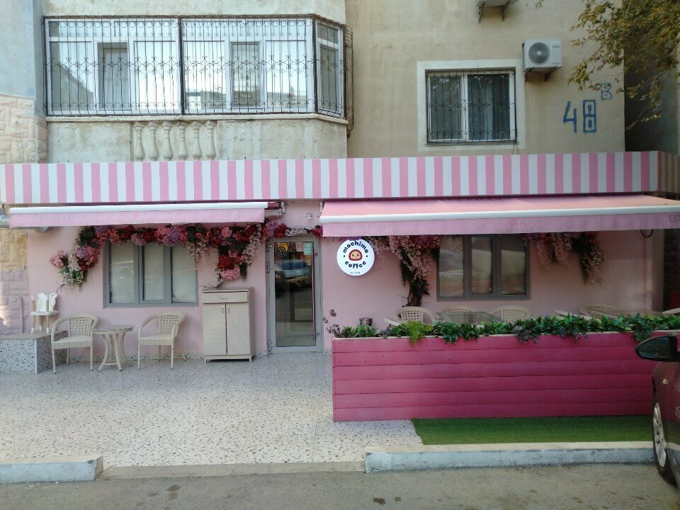 Kahve dükkanları The Pink Elephant, Atırav, foto