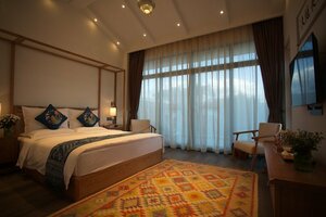 Lijiang Stay Long Guest House (Yunnan Province, City of Lijiang, Yulong Naxi Autonomous County, Lijiang Station), otel  Lijiang'dan