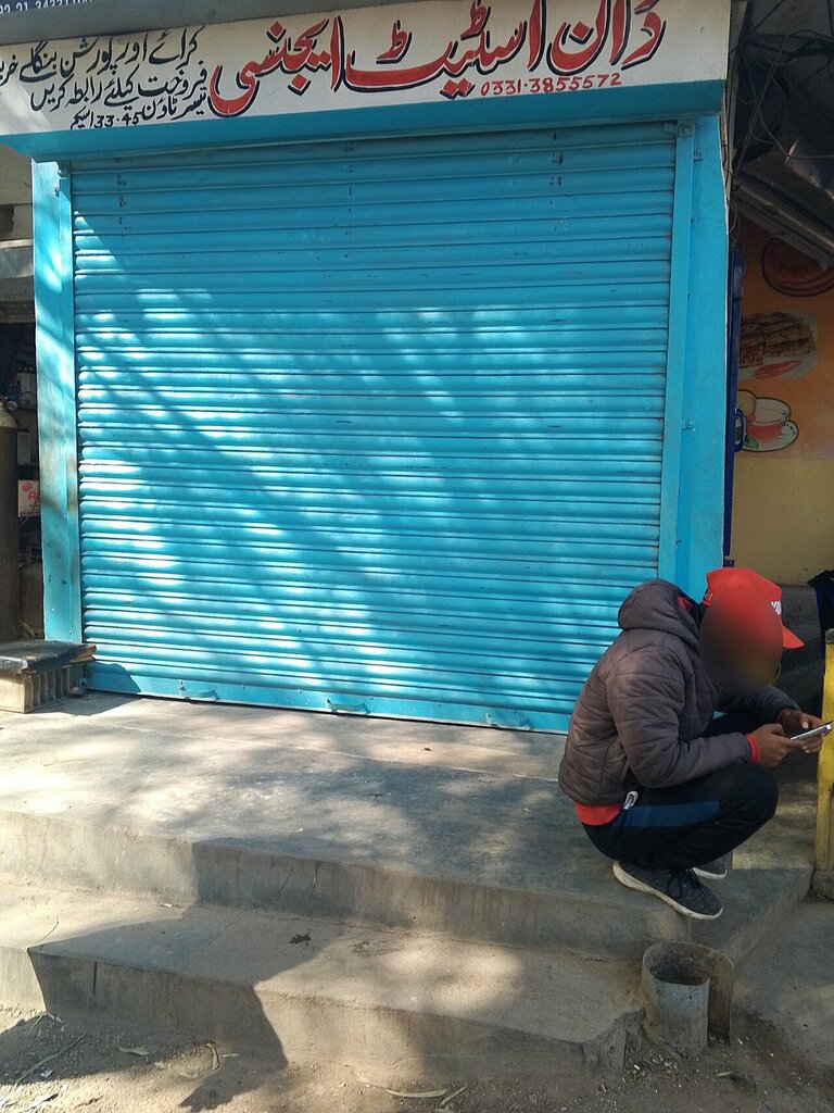 Emlak ofisi Dawn Estate, Karaçi, foto