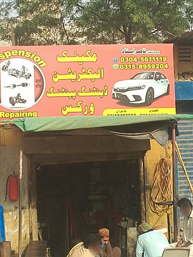 Otomobil servisi Mechanic electrician denting painting workers, Karaçi, foto