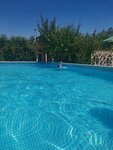 Raiskii Ugolok Mini-Hotel (Tamanskiy pereulok No:13, posyolok Kuchugury), otel  Krasnodarski krayından