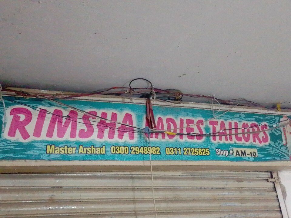 Kıyafet tamiri Rimsha, Karaçi, foto