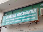 Madina associates (Badar Commercial 8th Street No:12C), emlak ofisi  Karaçi'den