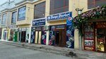 Dunyosharlari (Xusniobod koʻchasi No:1/132, Mustaqillik mahalla fuqarolar yigʻini), yönetim ofisi  Karşı'dan