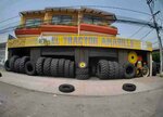 El Tractor Amarillo (Santa Cruz de la Sierra, Distrito Municipal 1, Subdistrito 30, Mataral, 93), jant ve lastikçiler  Bolivya'dan