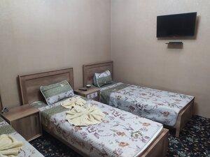 Hotel Uvaysiy (To'ralar ko'chasi No:123, Margilan), otel  Mergilân'dan