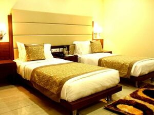 Capital O 1338 Hotel Harmony (State of Gujarat, Rajkot, Rajkot Bus Rapid Transit System, Nana Mava Chowk Metro Bus Station), otel  Rajkot'tan