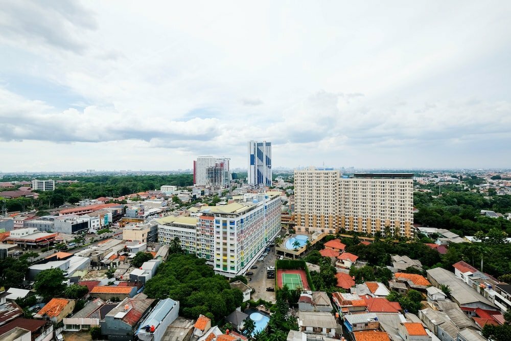 Otel Cozy and Modern 1br Apartment at Atlanta Residences by Travelio, Depok, foto