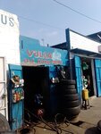 Du rond point (Brazzaville, Avenue des Trois Martyrs), oto lastik tamiri  Brazzaville'den