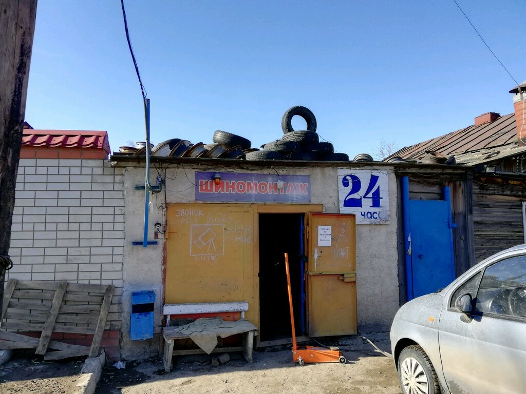 Oto lastik tamiri Shinomontazh, Engels, foto