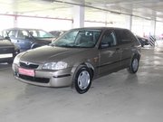 Mazda 323 VI BJ Рестайлинг 1.6 MT 98 л.с.бензин, передний