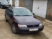 Toyota Carina VI T190 E 1.6 MT 107 л.с.бензин, передний