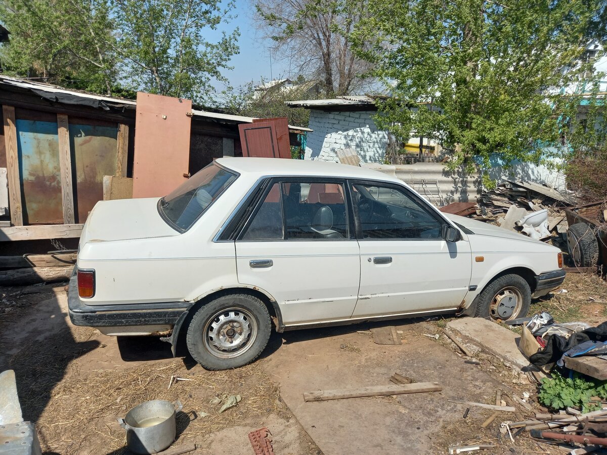 Купить б/у Mazda 323 III (BF) 1.5 MT (95 л.с.) бензин механика в Каргале: белый Мазда 323 III ...