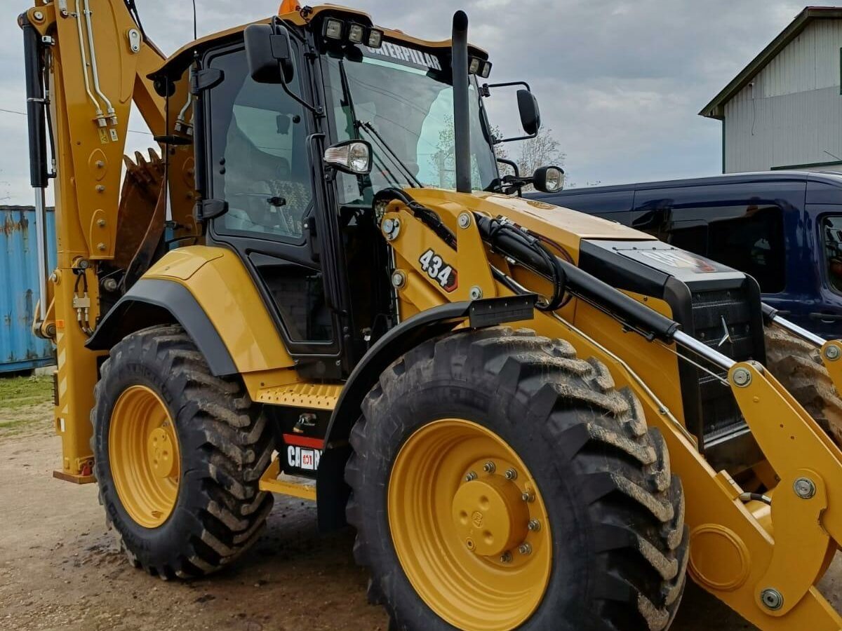 Купить б/у Caterpillar 434F в Обнинске: золотистый экскаватор-погрузчик ...