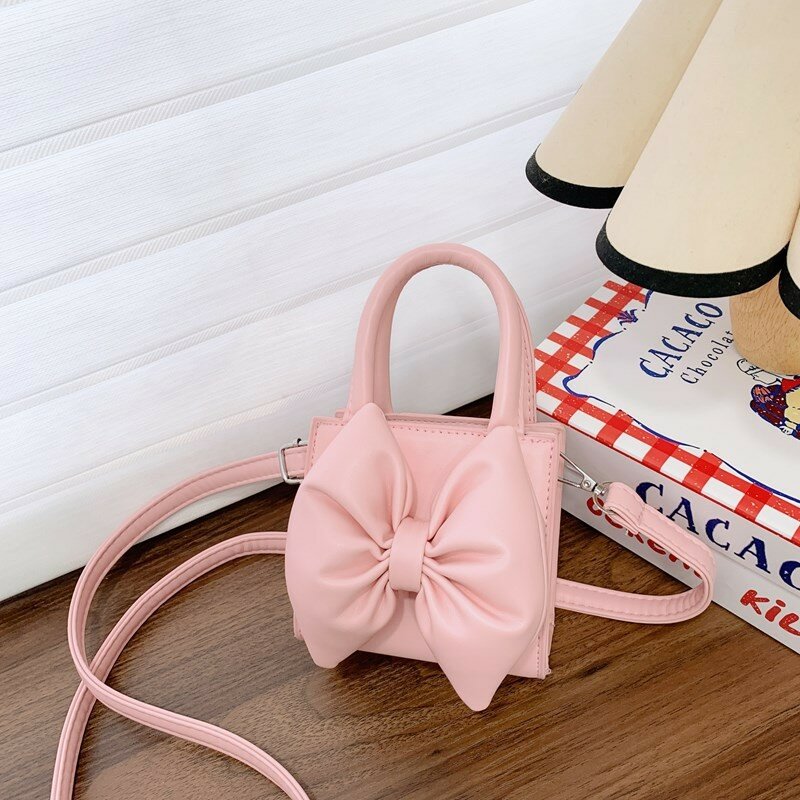 Girls mini shoulder bag with butterfly style made of soft pu for everyday use big bow pink