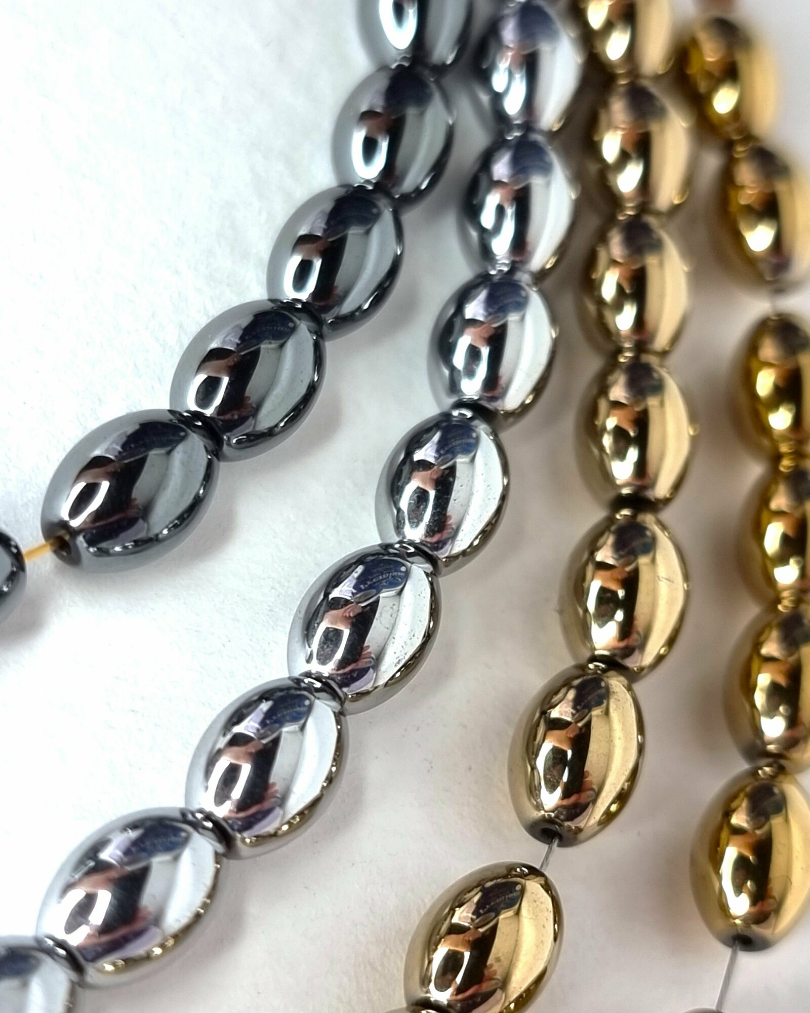 Гематит крупный рис. 9х6мм. 4 цвета по 9шт.