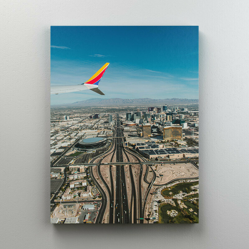 Интерьерная картина на холсте "Цветное крыло самолета в воздухе" размер 22x30 см