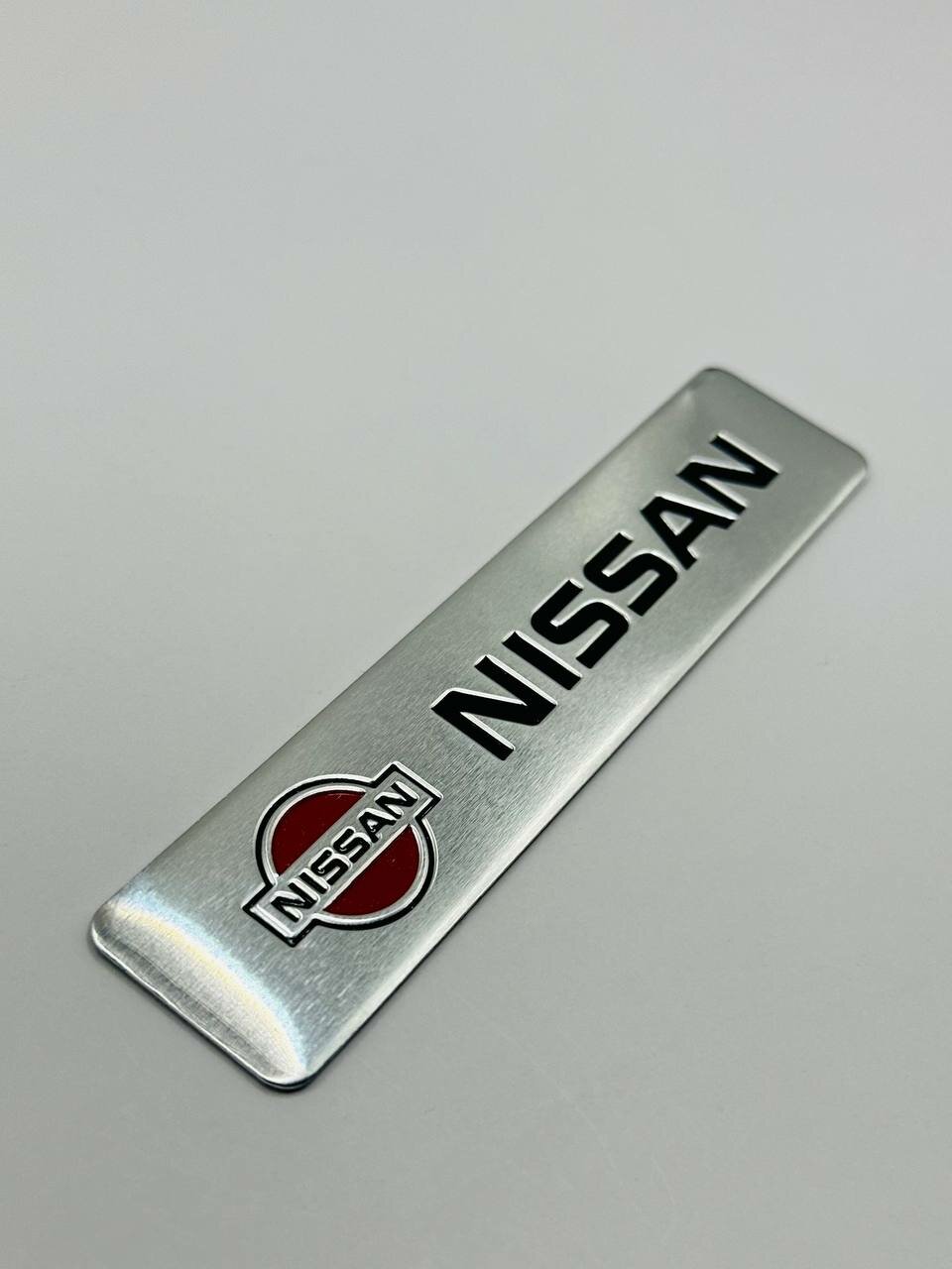 Шильдик надпись наклейка Nissan 12см