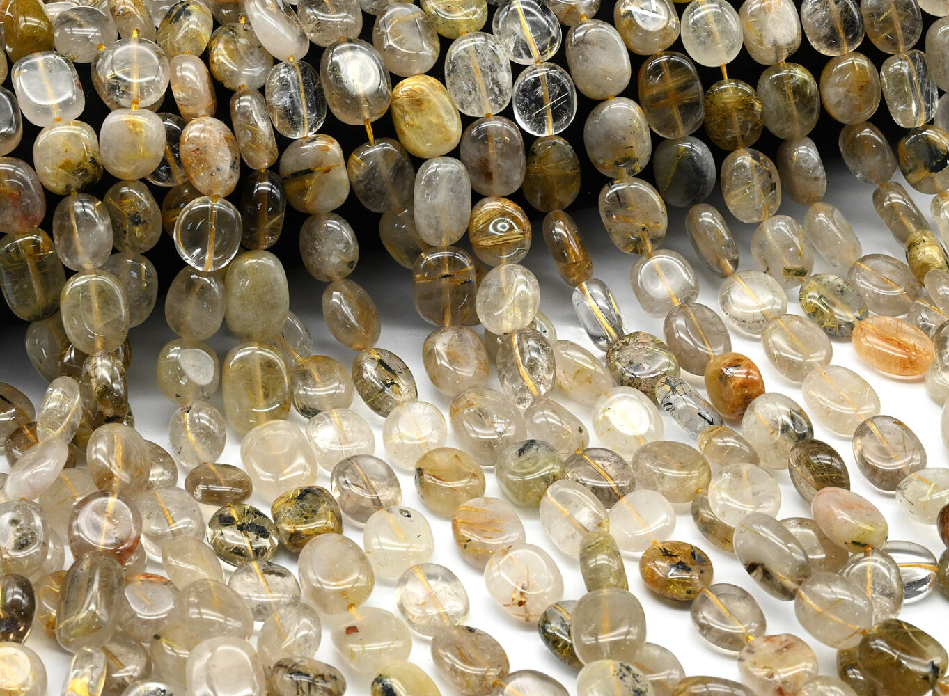 Бусины из рутилового кварца (волосатик золотой) овал 12*14мм, 39см, 27 бусин .