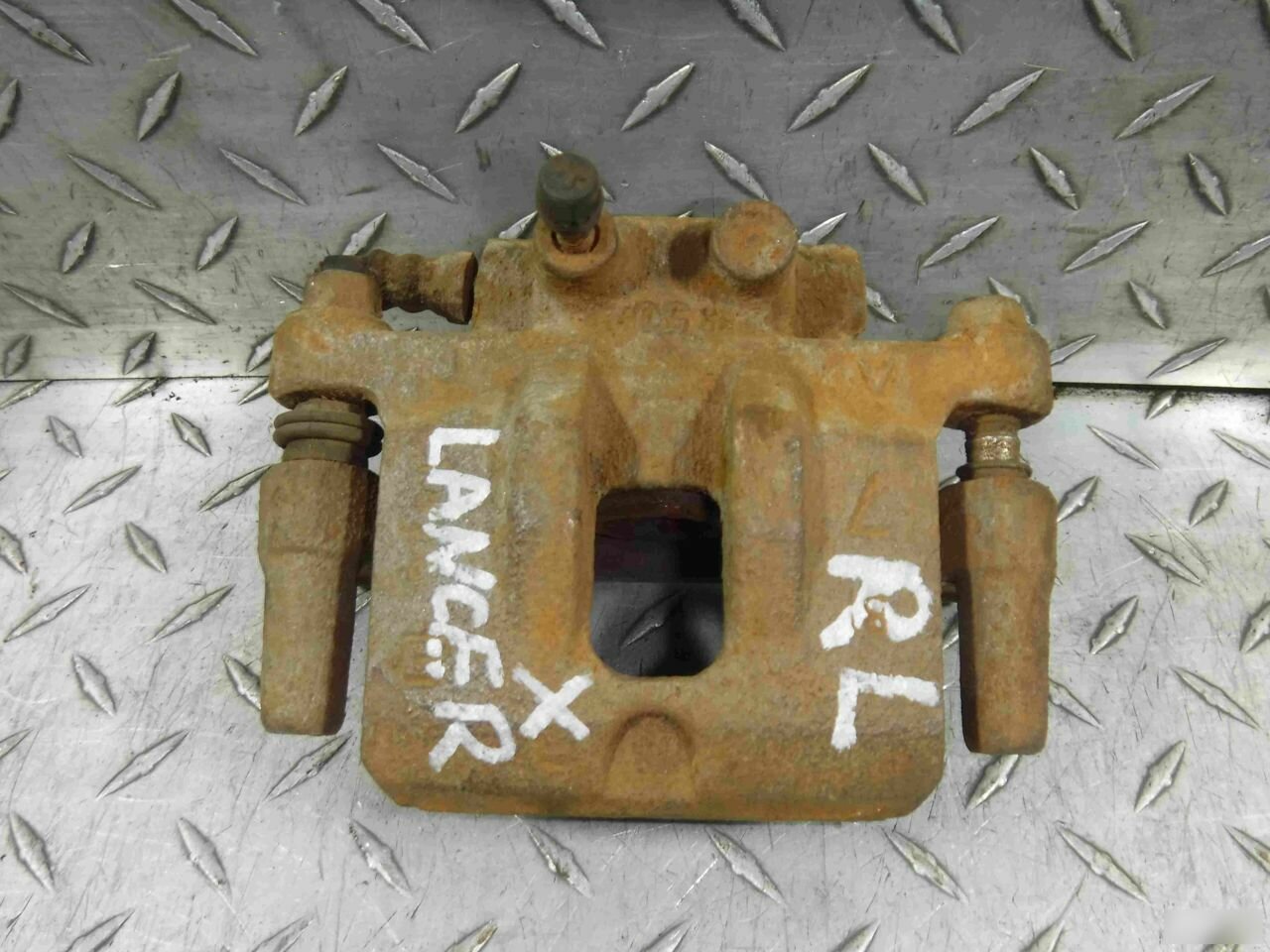 Суппорт тормозной задний левый Mitsubishi Lancer X (2007—2010) 4605A477