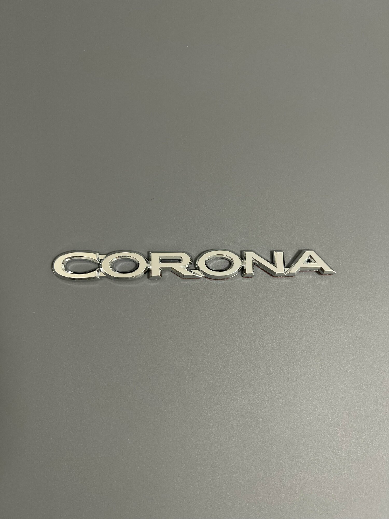 Шильдик CORONA на багажник авто