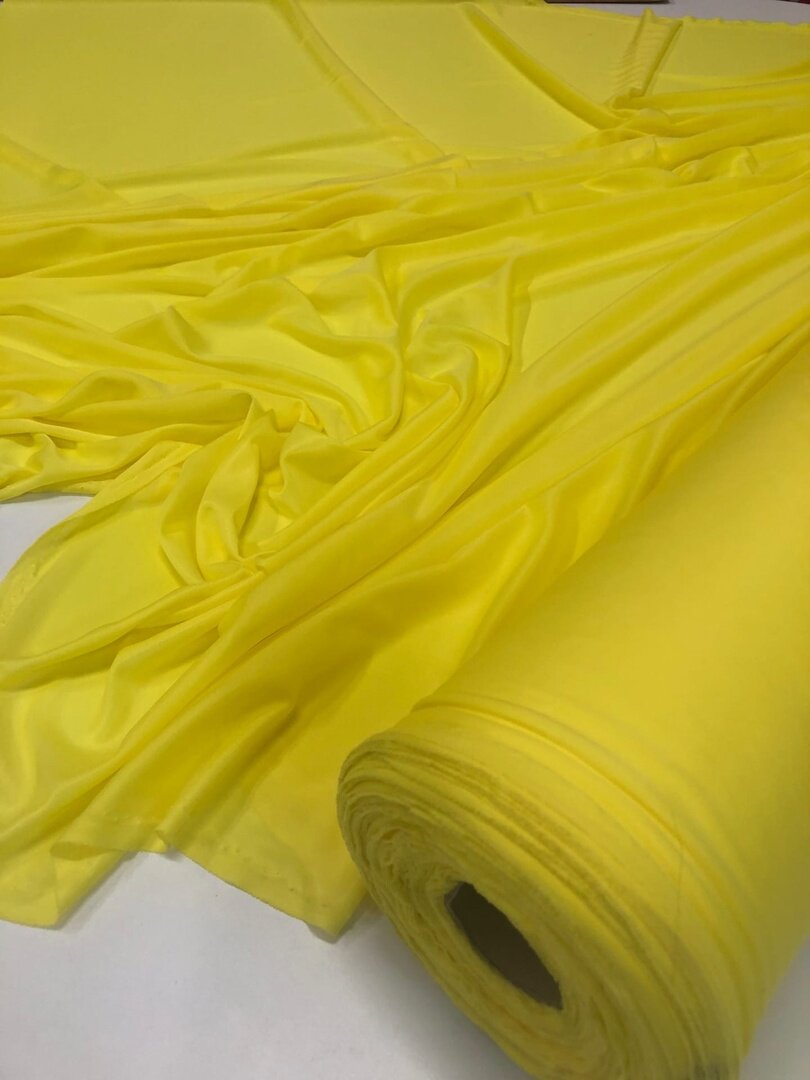 Ткань подкладочный трикотаж, цвет неоново-желтый, ширина 150см. цена за 1 метр погонный.