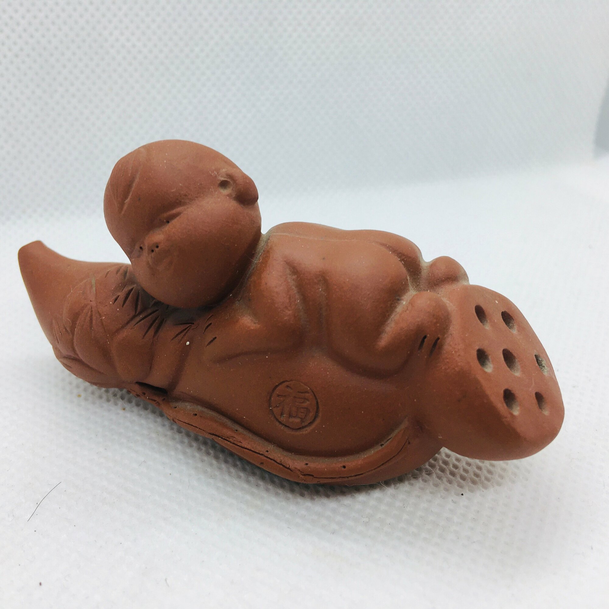 Мальчик на Лотосе фигурка из керамики