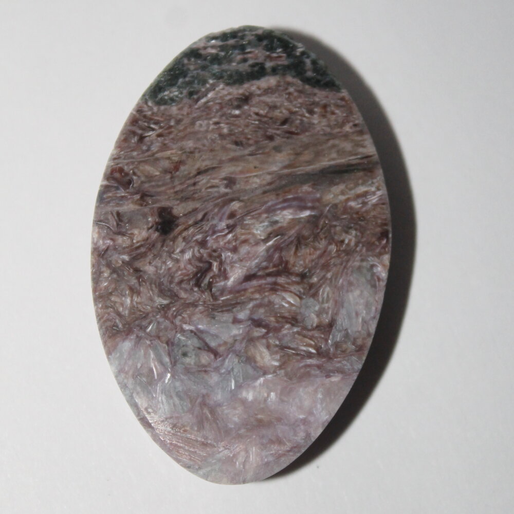 Коллекционный кабошон Чароит, 43х28х4 мм, Якутия, "True Stones" — фото 1
