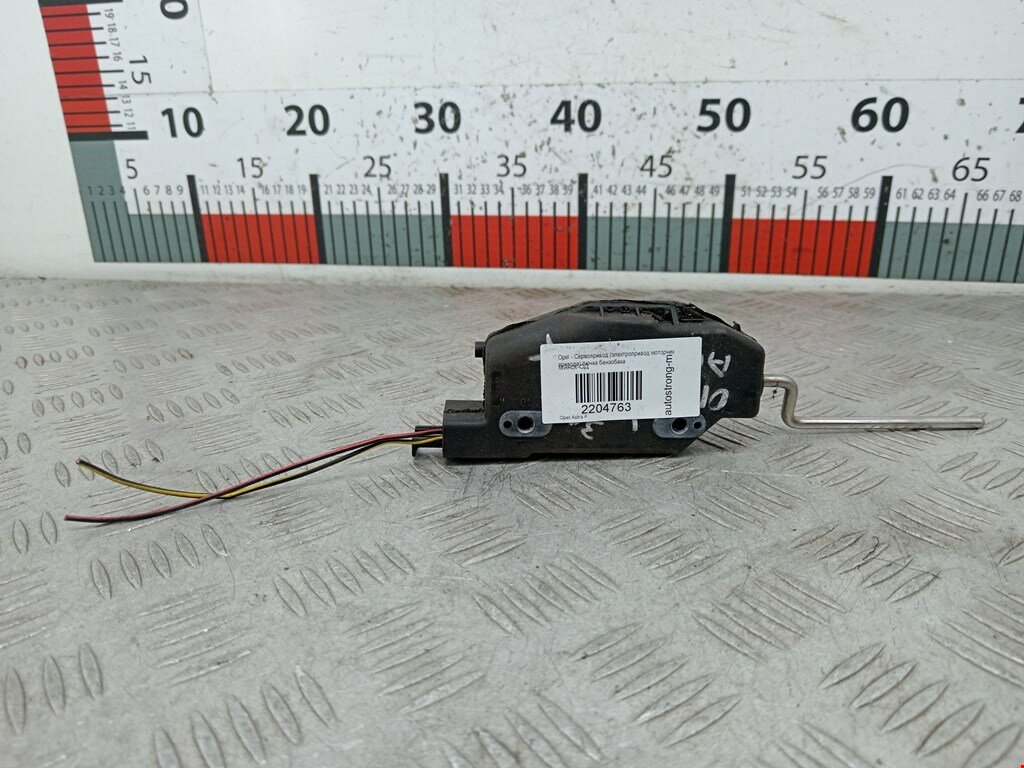 Сервопривод (электропривод моторчик привода) лючка бензобака Opel Astra F 90414159 арт. 2204763