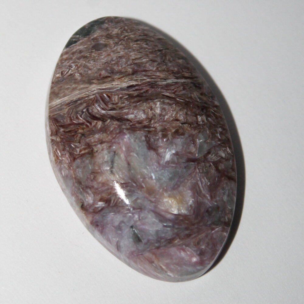 Коллекционный кабошон Чароит, 43х28х4 мм, Якутия, "True Stones" — фото 1