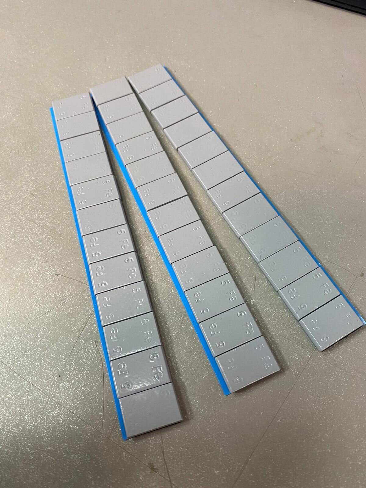 Груз самоклеящийся стальной 12х5 г (уп. 100 шт) серая эмаль (синий скотч)