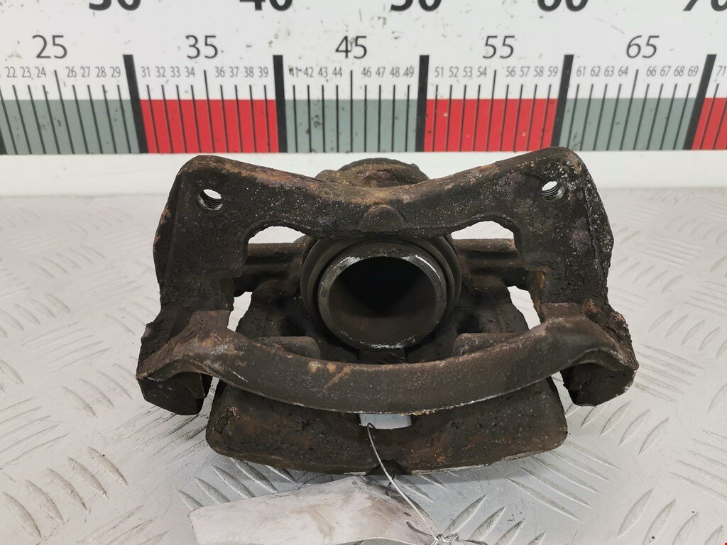 Суппорт передний левый Mitsubishi Colt 6 4605A065 арт. 1529447