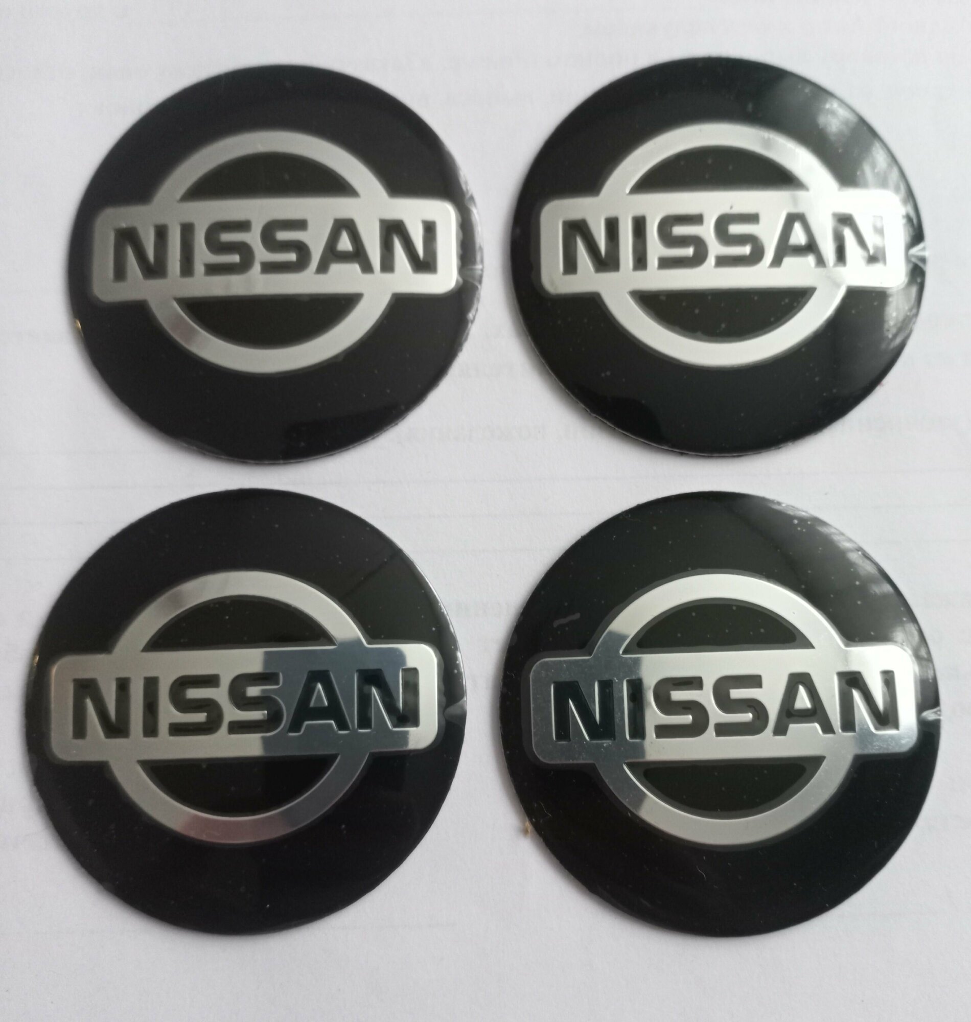 Наклейки на колесные диски и колпаки Nissan Ниссан D 65 mm, комплект 4 шт.
