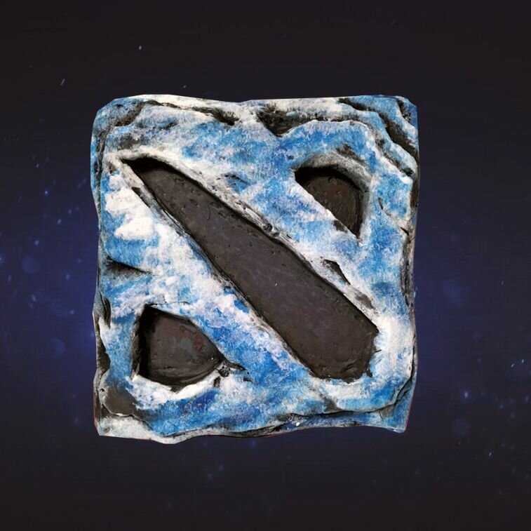 Барельеф-логотип "Dota 2" со светящимся в темноте эффектом.