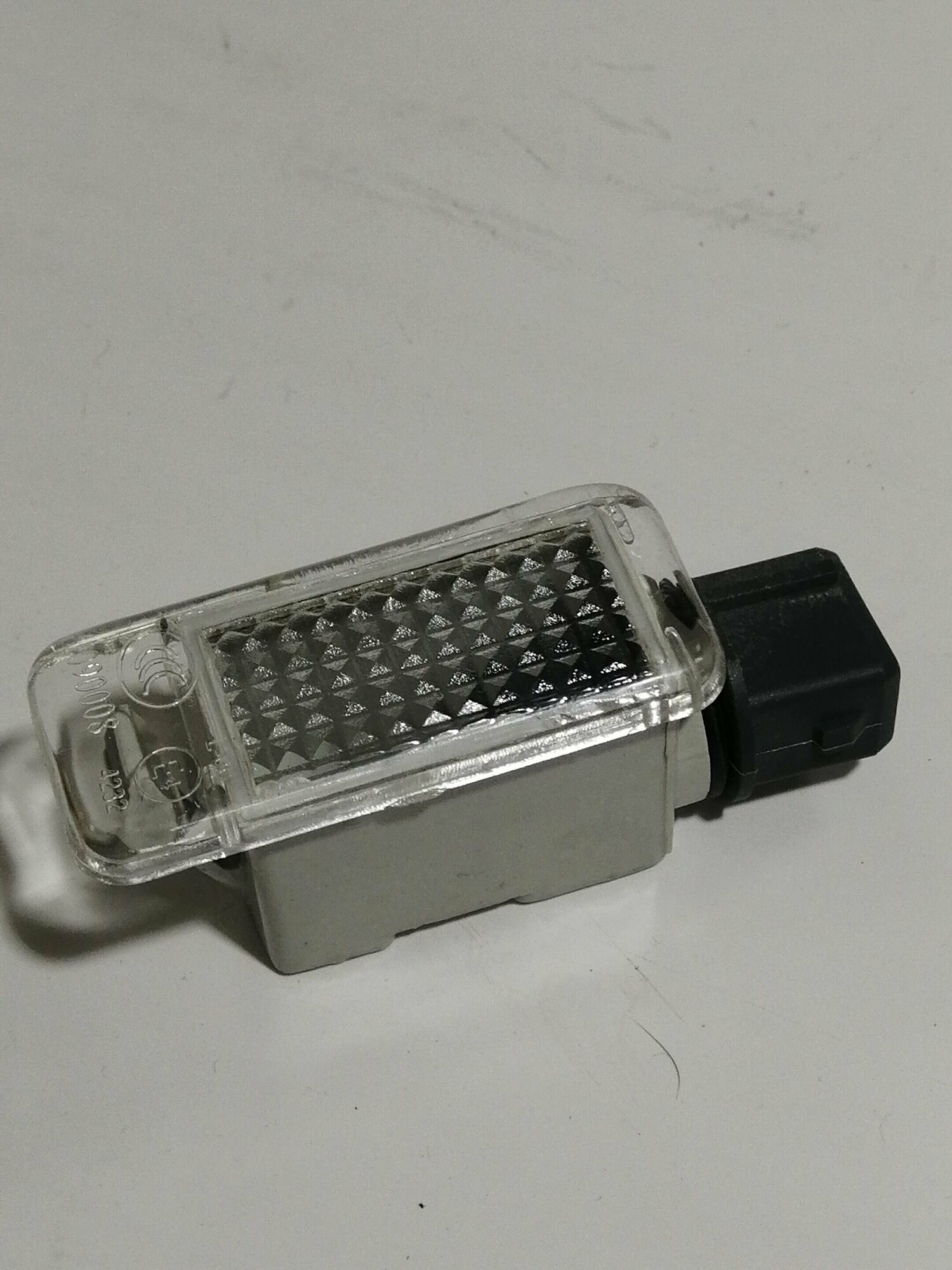 Фонарь номерного знака Geely Emgrand EC7 [1.8 16V 5MT седан] 1067001313