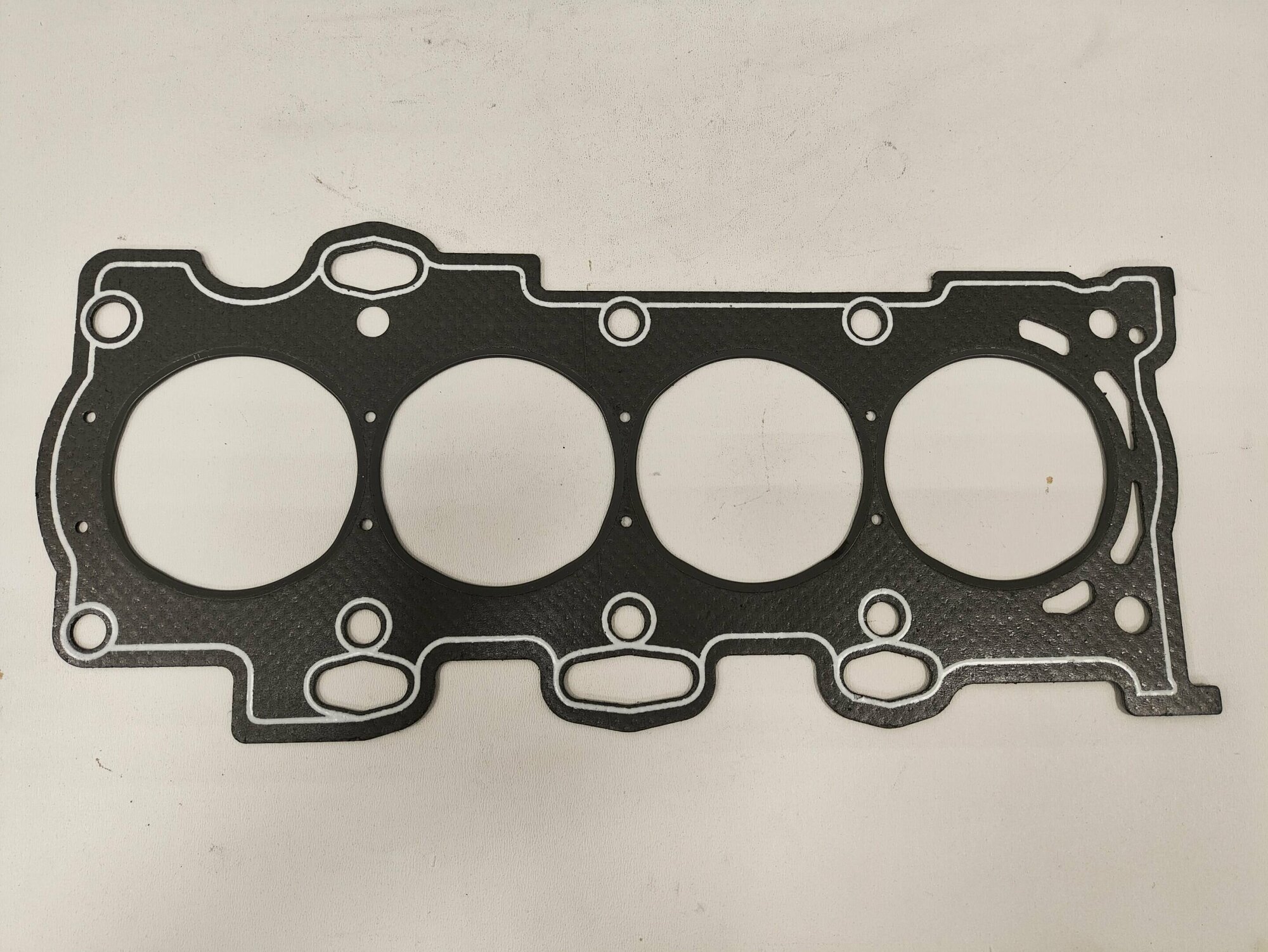 Прокладка ГБЦ (паронит)(сборка Беларусь) Geely Emgrand EC7 [1.5 16V 5MT хетчбэк] 1016050751