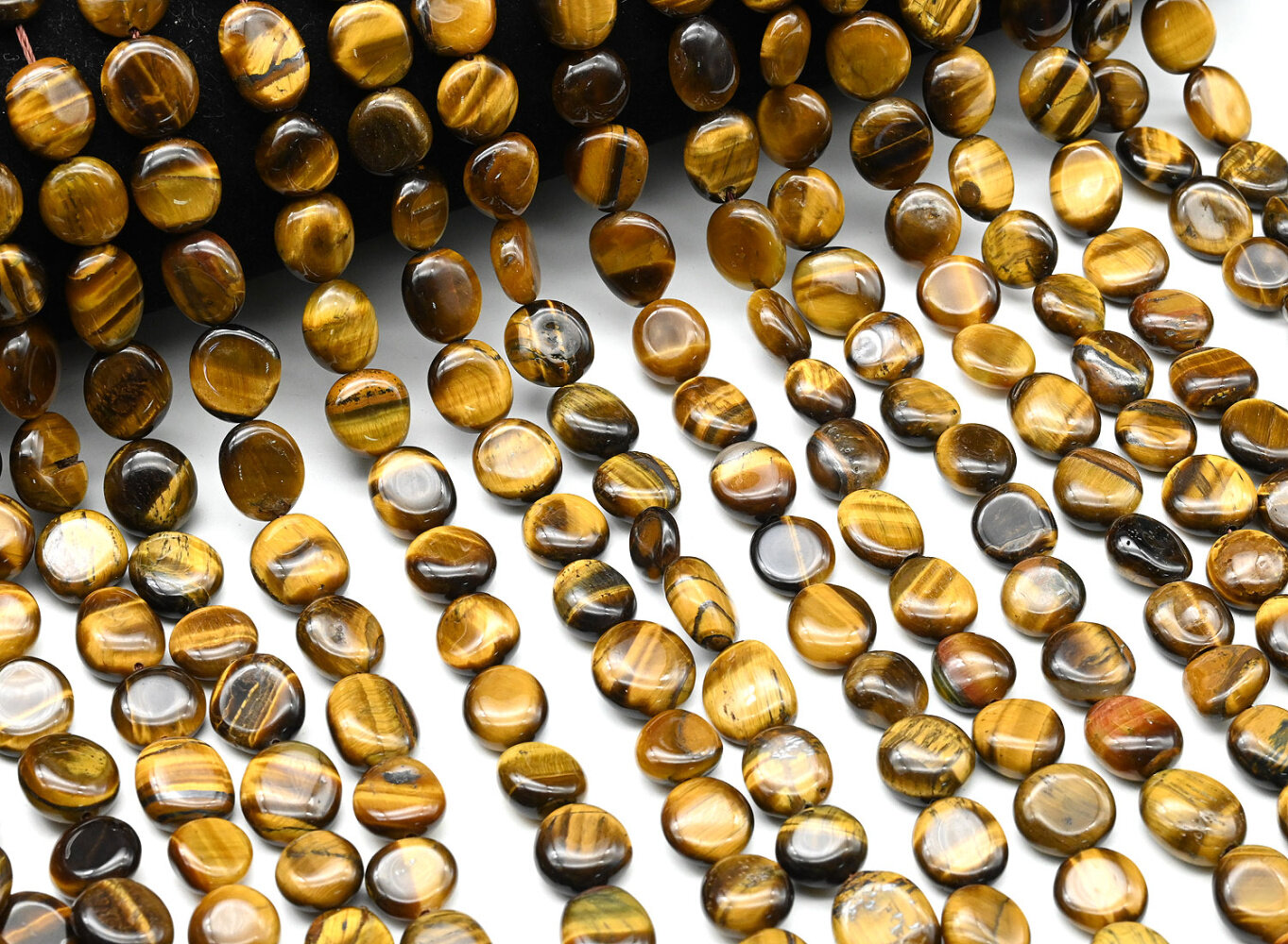 Бусины из тигрового глаза галтовка 10*12мм, 39см, 33 бусины .