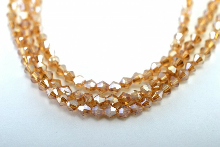 Бусина стеклянная биконус 3х3,5мм, цвет бежевый, гальваническое покрытие, прозрачная, 557-015, 1 нить (около 110шт)