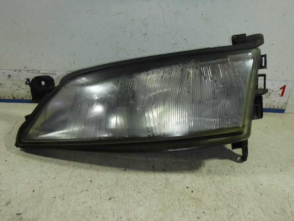 Фара левая Opel Vectra B 1216011