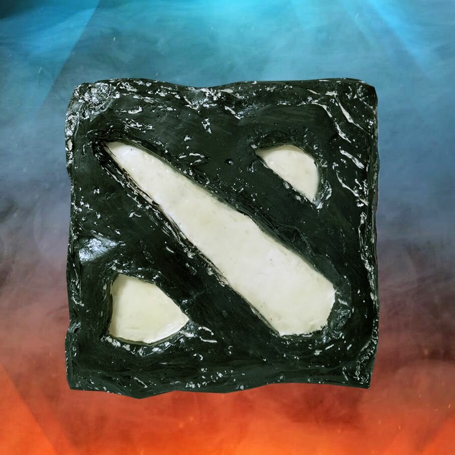 Барельеф-логотип "Dota 2" со светящимся в темноте эффектом.