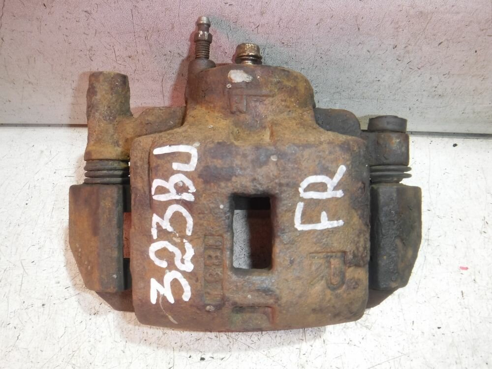 Суппорт передний правый Mazda 323 BJ