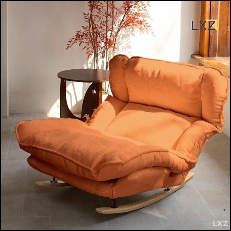 Эксклюзивное кресло для домашнего кинотеатра в оранжевом текстиле, обеспечивающее роскошный отдых