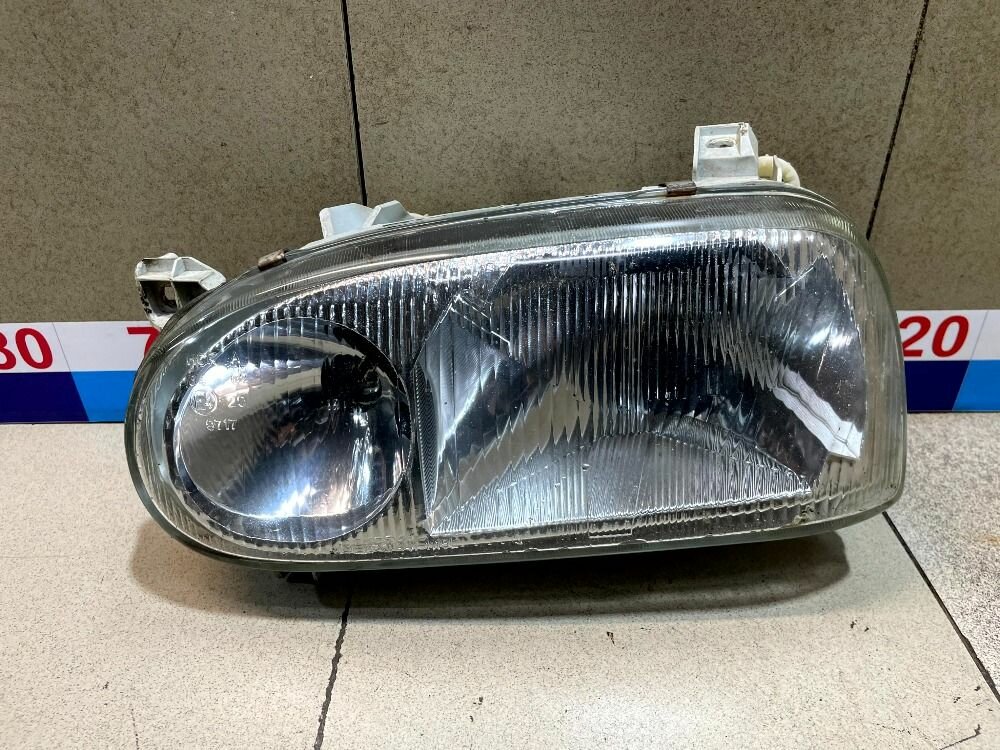 Фара левая VW Golf III 4411115LLDE