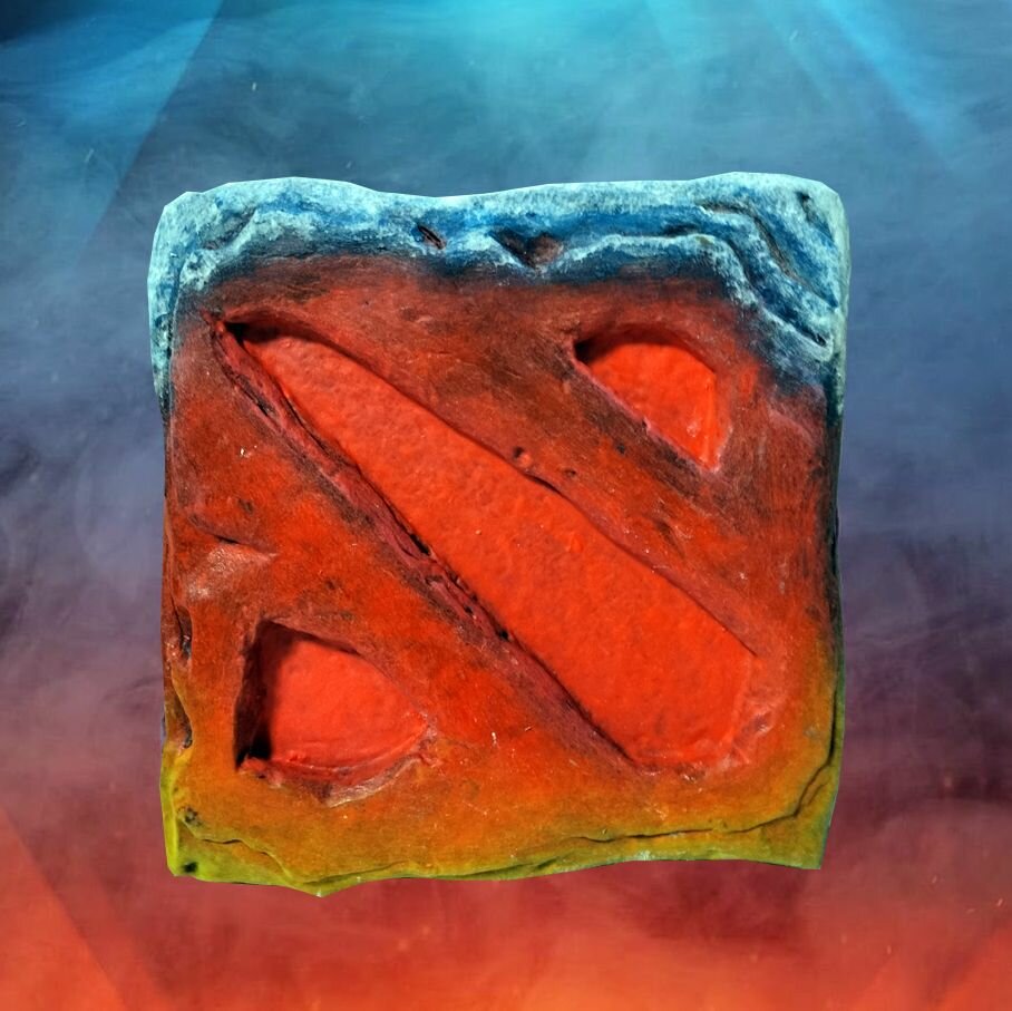 Барельеф-логотип "Dota 2" со светящимся в темноте эффектом.