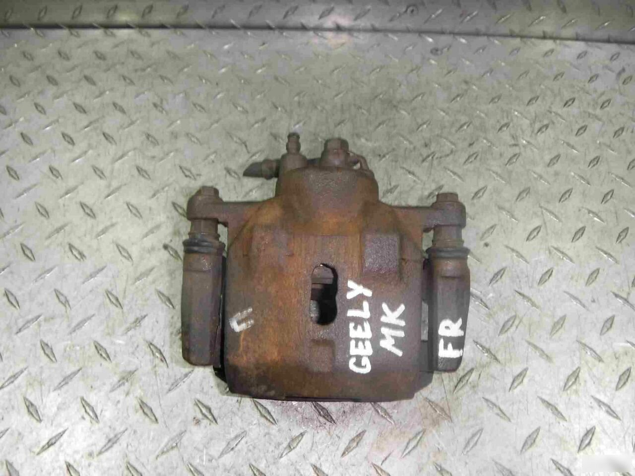 Суппорт тормозной передний правый Geely MK I (2006—2013) 1014001810