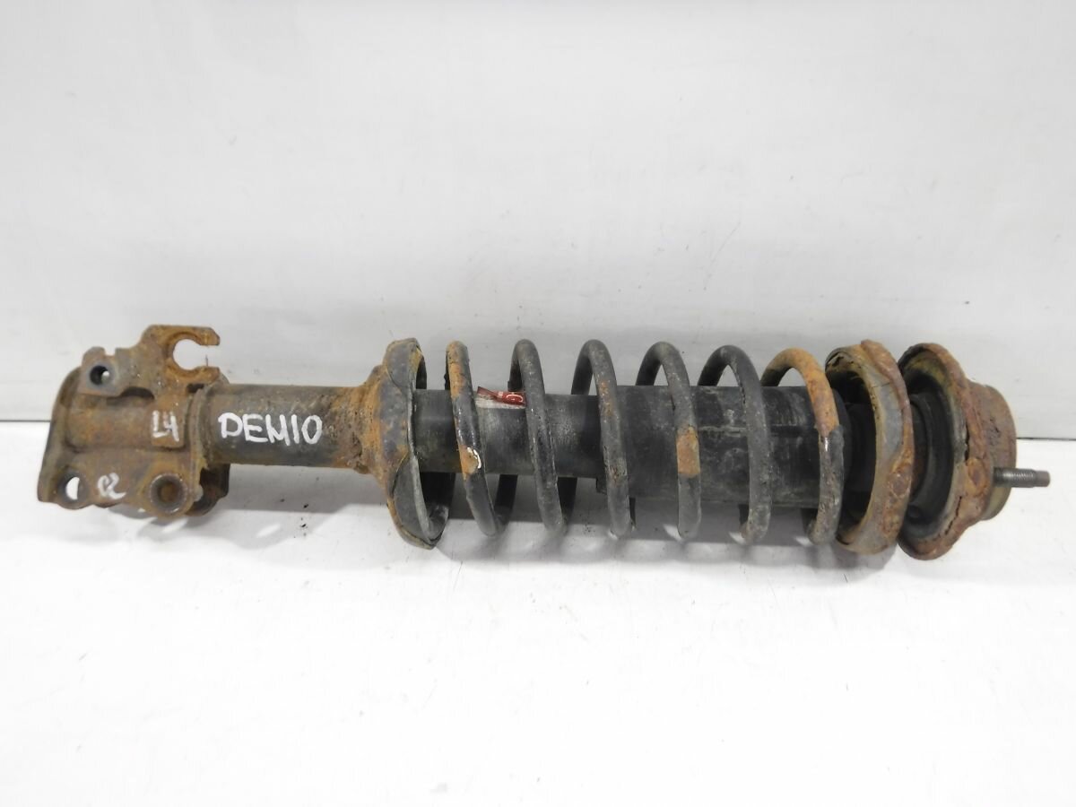 Амортизатор передний левый Mazda Demio DW (1996—2003) DC3734900