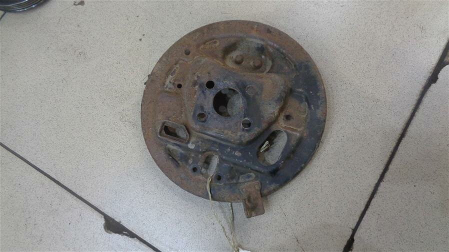 Щит опорный задний левый от Mazda Demio DW 1996-2002