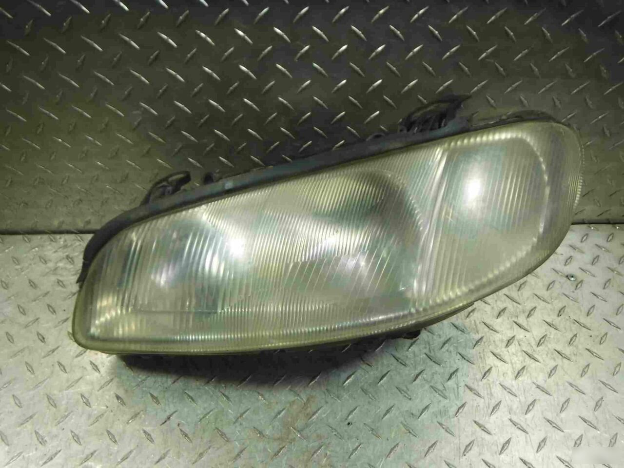 Фара левая Opel Omega B (1994—1999) 90487567