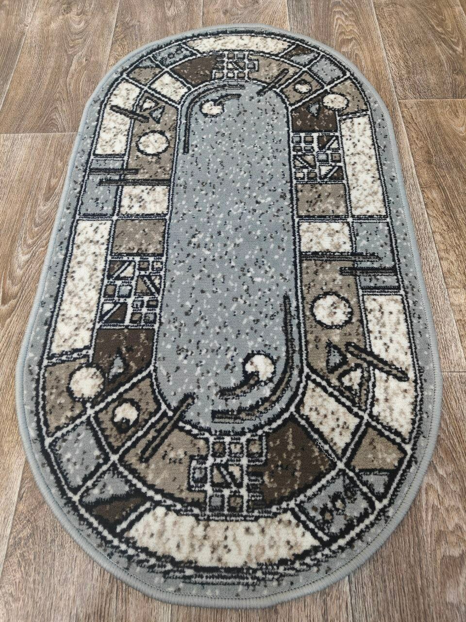 Коврик на пол серо голубой с нескользящей основой овальной формы размер 60 на 110