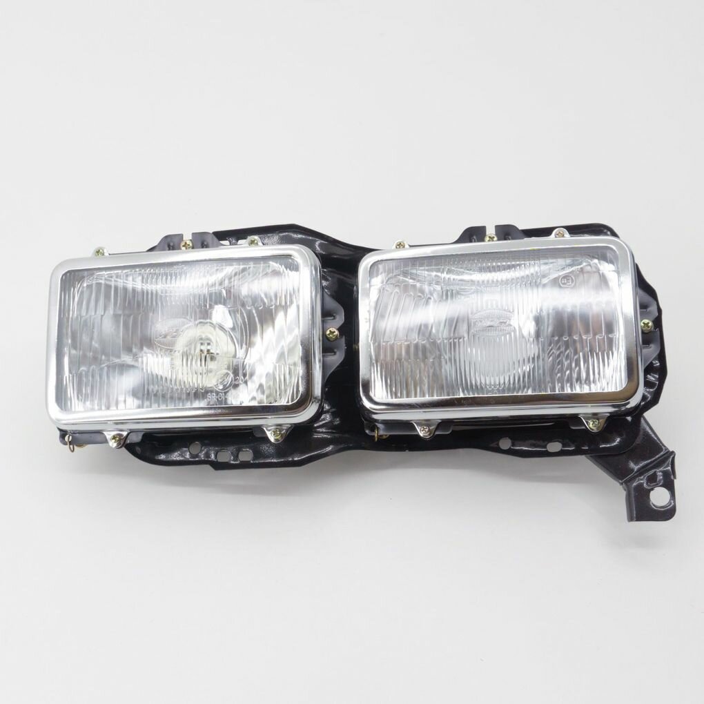 Фара ISUZU ELF 1985-1993 г левая, ZEVS